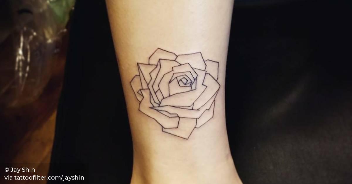 Shin tattoo of a polygon rose by Jay Shin.