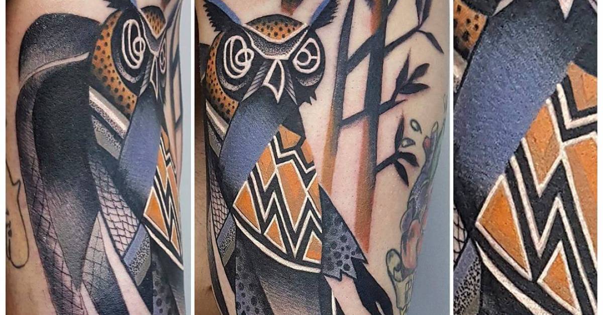 Illustrative owl tattoo on the left upper arm.