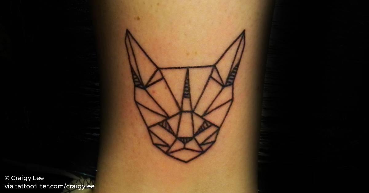 Polygon Cat on the ankle by tattoo artist Craigy Lee.