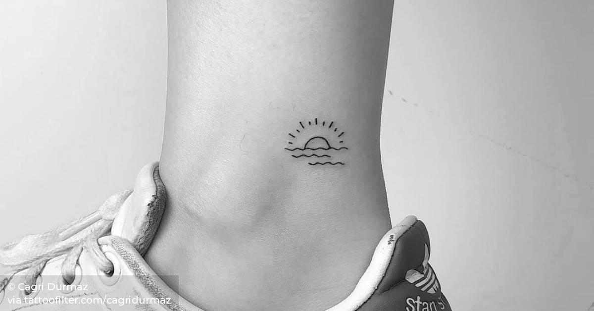 Fine line sunset tattoo on the ankle.