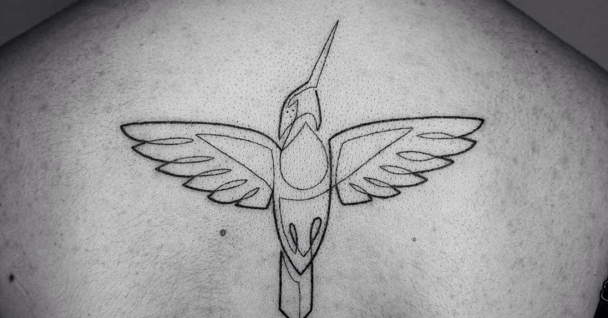 Continuous line hummingbird tattoo on the upper back.