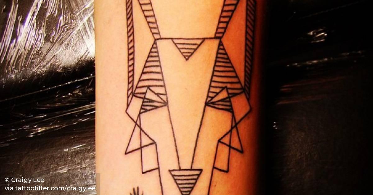 Forearm tattoo of a polygon wolf and a cat, by Craigy