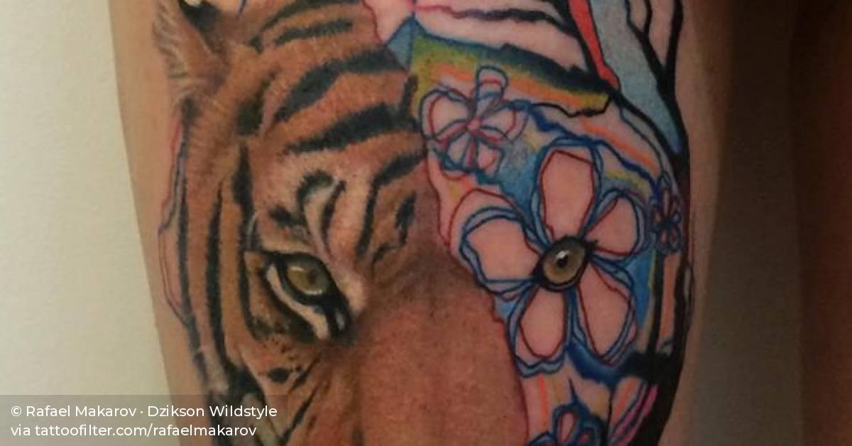 Tiger portrait mashup tattoo on the right thigh.