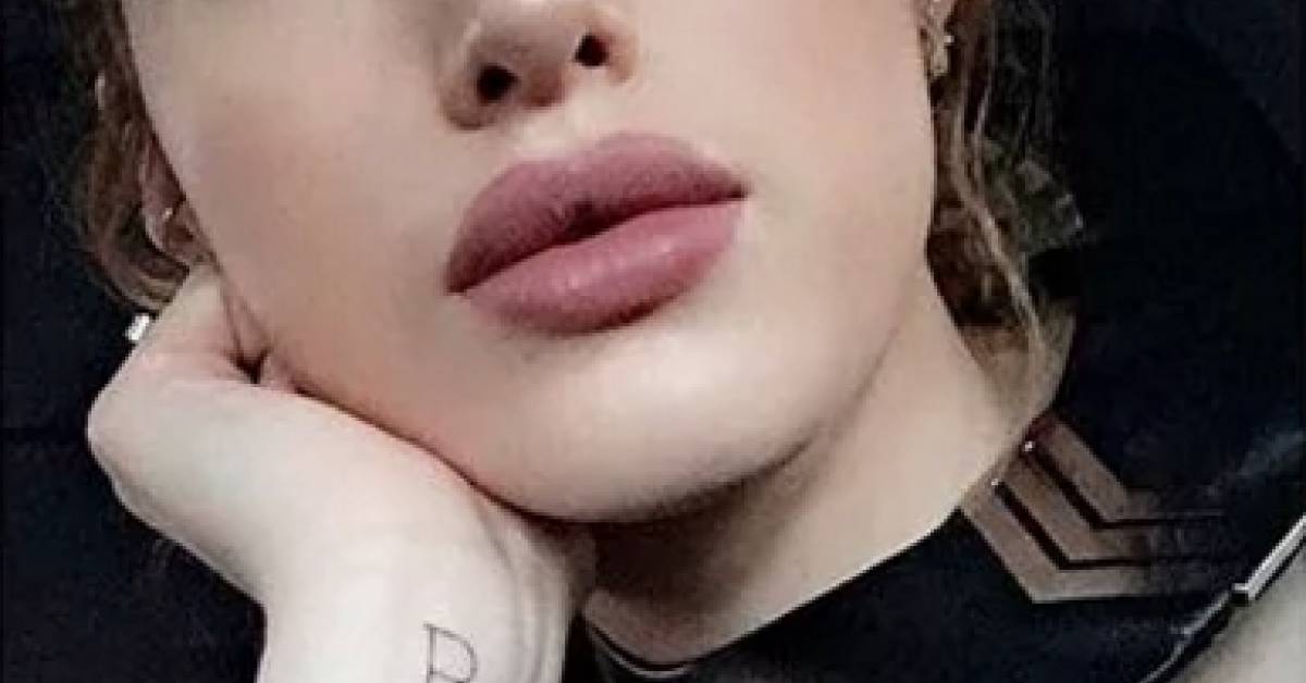 Small B2 (Bella Squared) matching tattoo on the wrist.