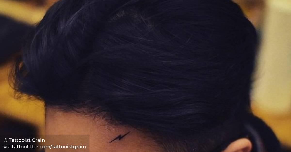 Bolt tattoo on the forehead.