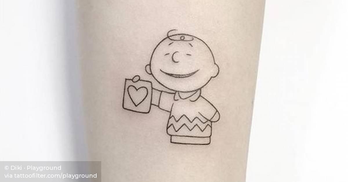 Charlie Brown tattoo on the inner forearm.