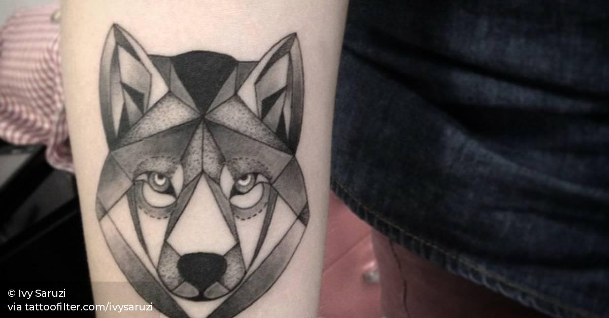 Forearm tattoo of a polygon wolf by Ivy Saruzi.
