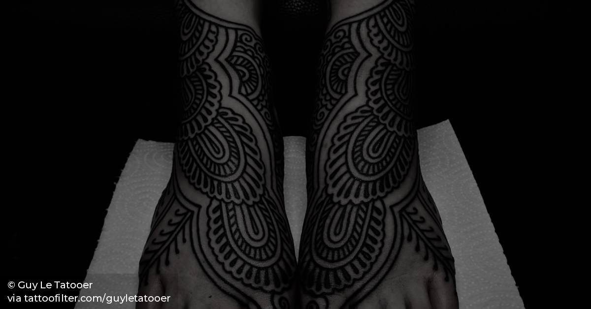 Matching henna inspired tattoos on Bertine.