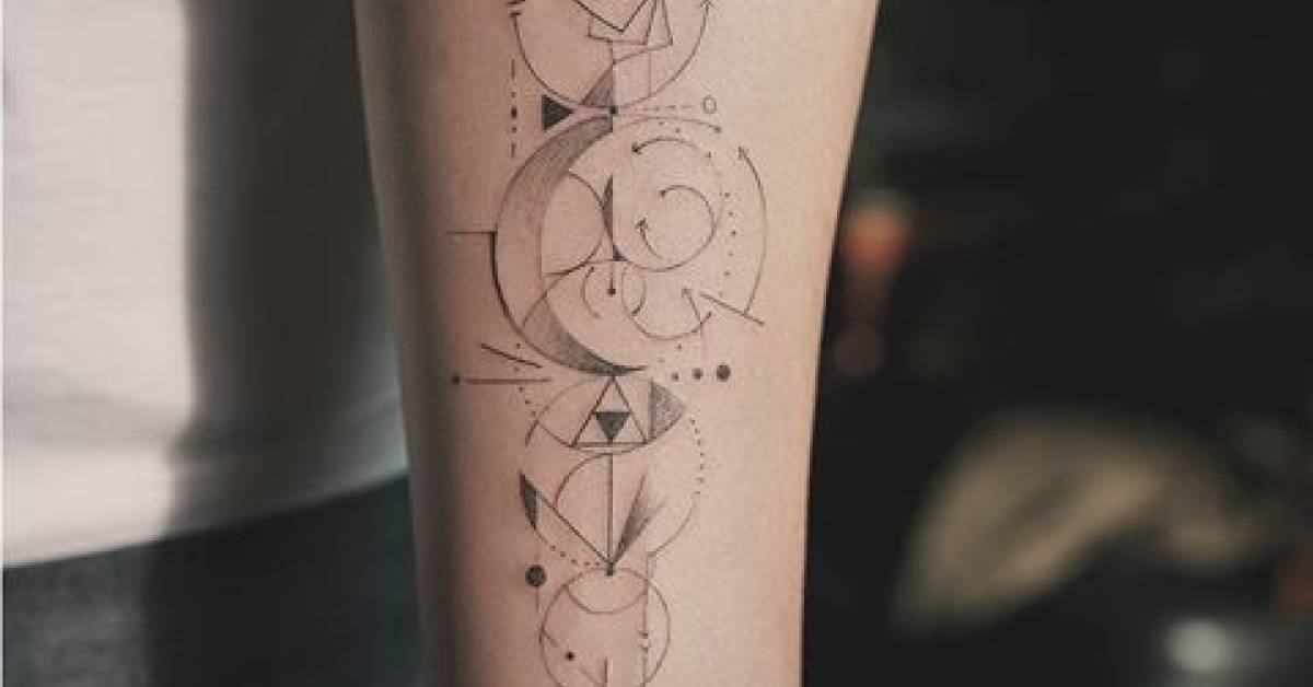 Fine line geometric tattoo on the left inner forearm.