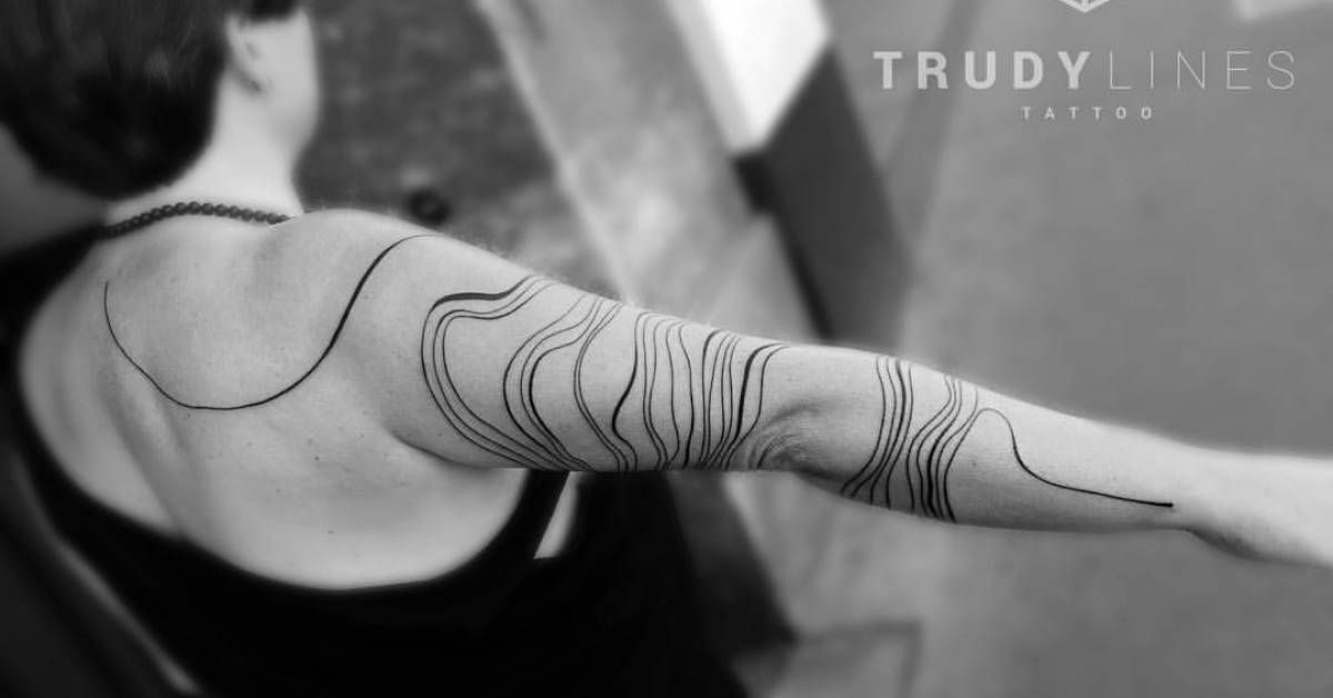 Single line arm tattoo.