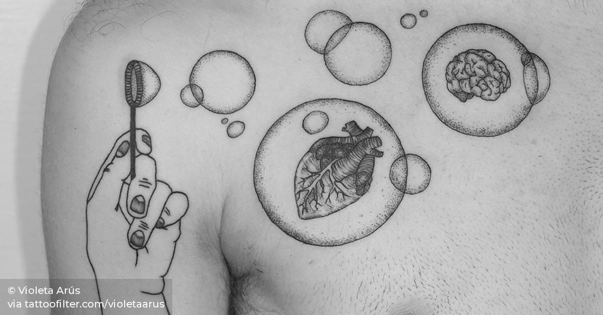 Soap bubble tattoo on the right shoulder and chest.