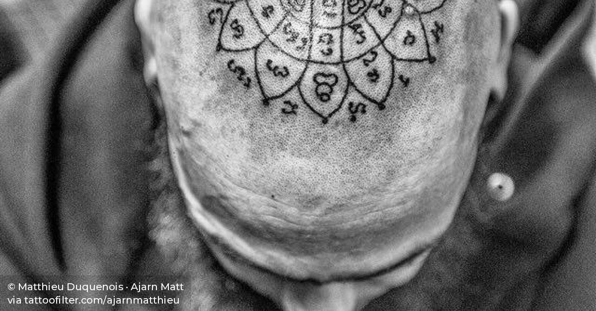 Sak Yan style tattoo on the head.