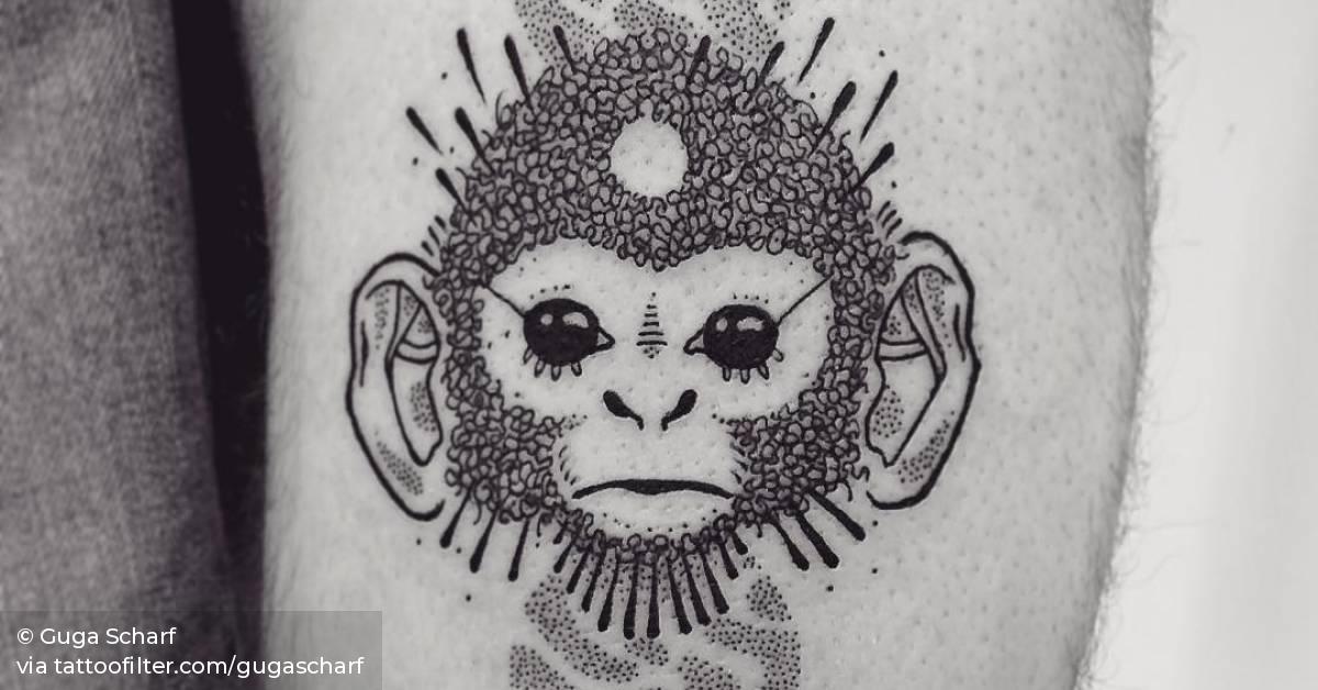 Capuchin monkey tattoo on the left thigh.