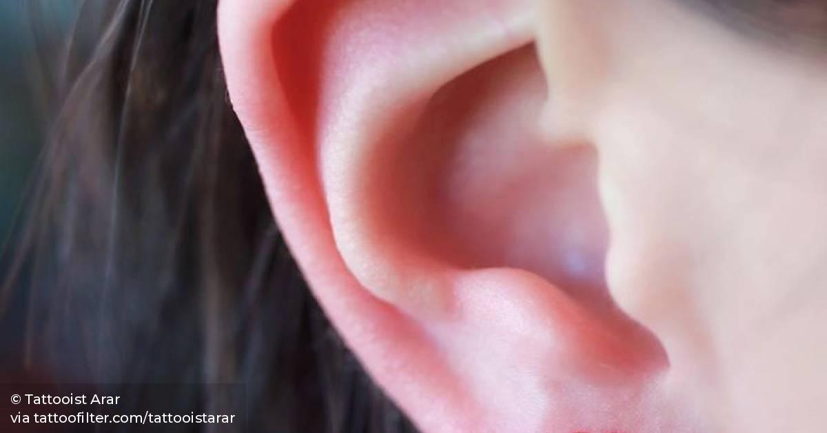 Ear love heart tattoo.