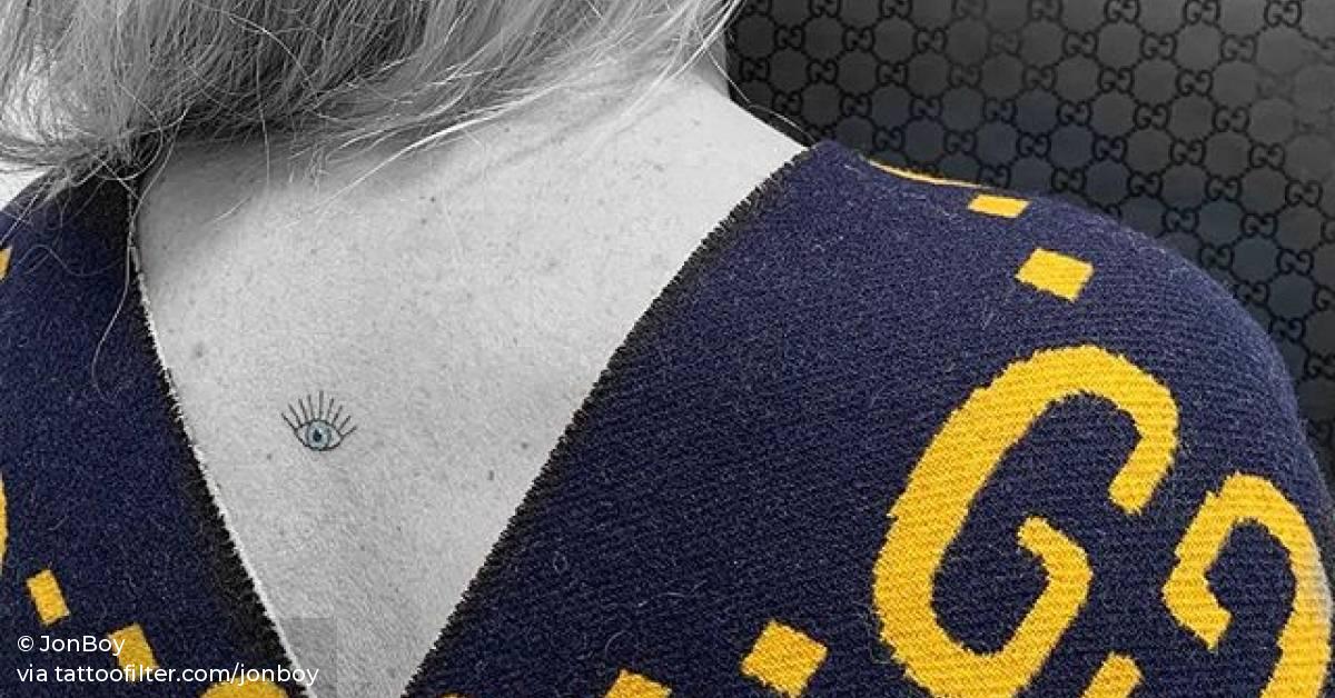 Eye tattoo on the upper back.