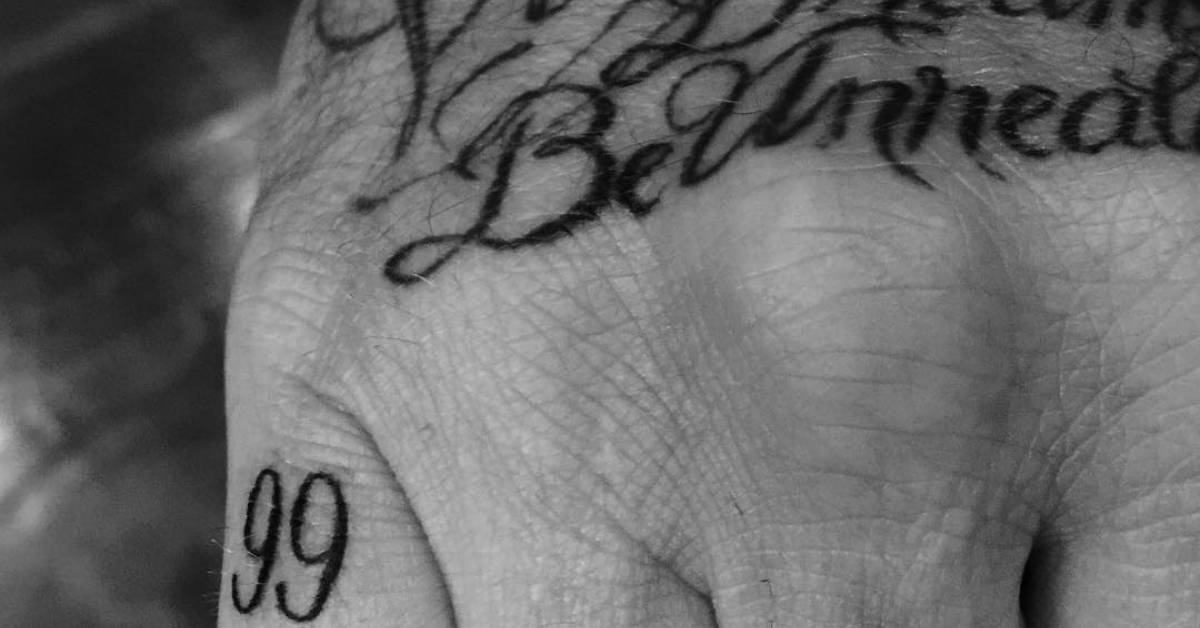 Finger tattoo of number 99 on David Beckham's right