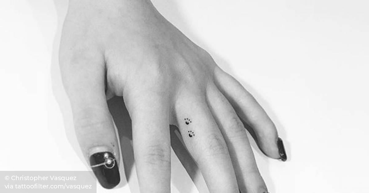 Paw prints on the middle finger.