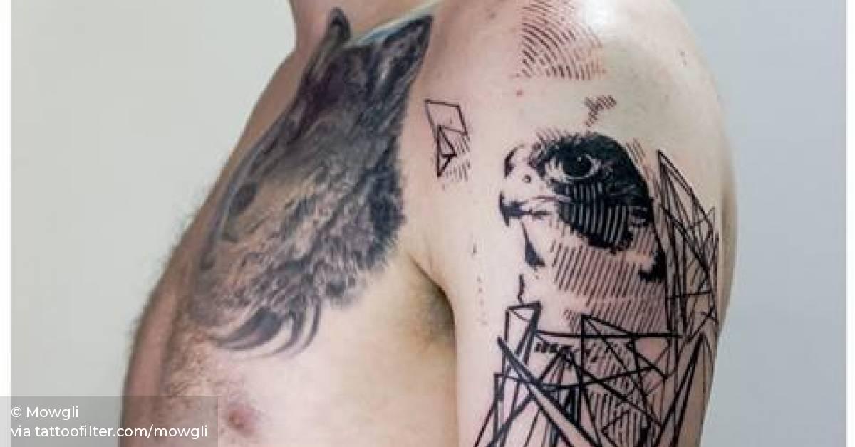 Graphic falcon tattoo on the left upper arm named