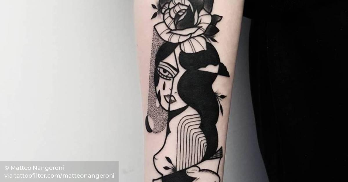 Abstract illustrative tattoo on the right inner