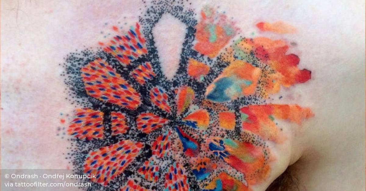 Abstract piece on the left side of the chest.