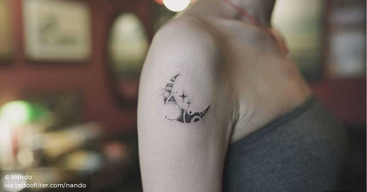 Moon tattoo on the right shoulder.