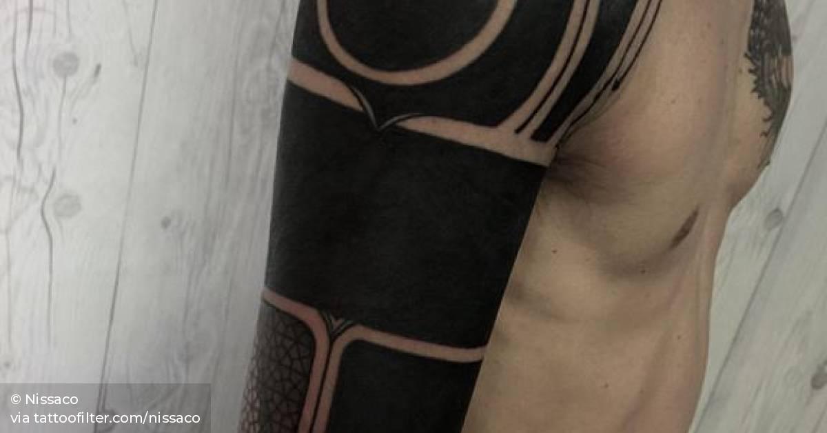 Blackout cover tattoo on the right arm.