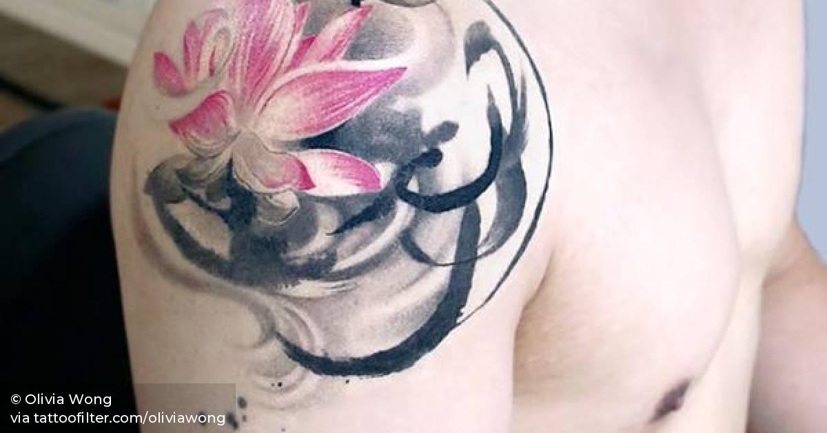 Graphic lotus flower tattoo on the right shoulder.