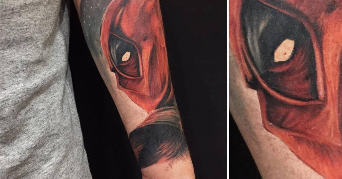 Deadpool tattoo on the left inner forearm.