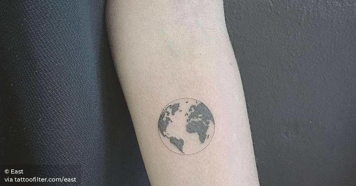 Fine line planet earth tattoo on the left inner