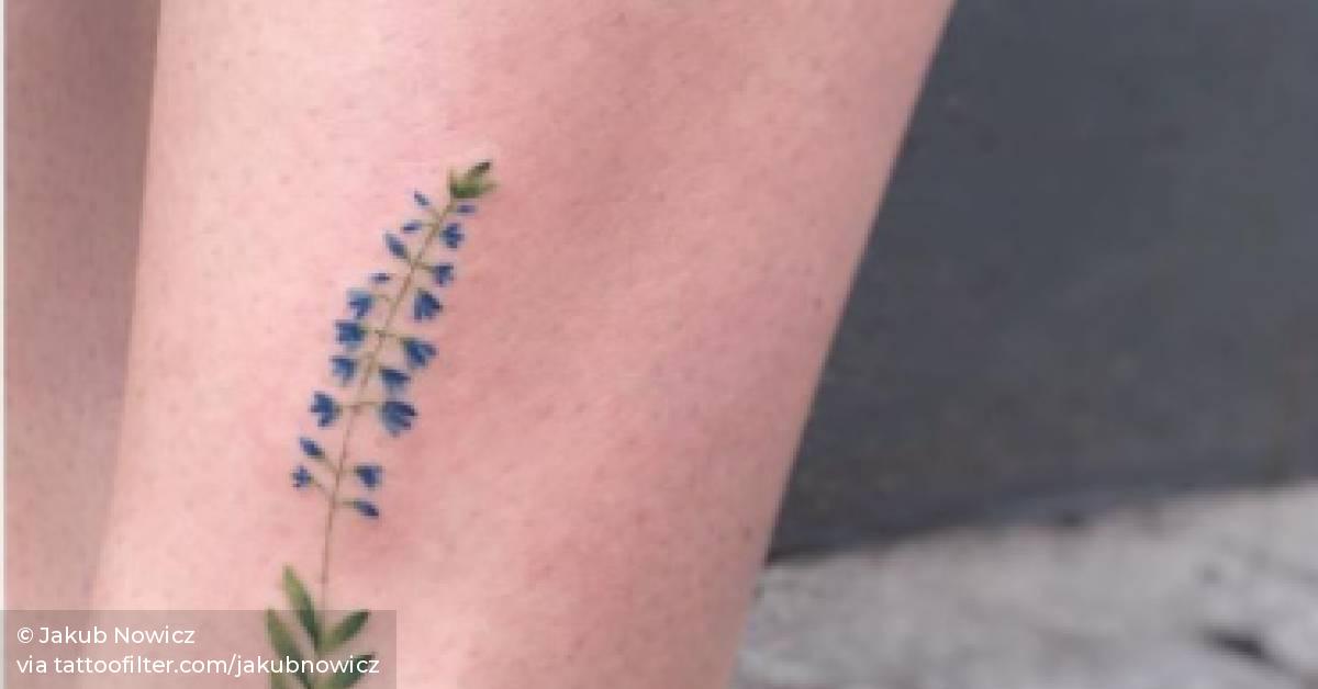 Small heather tattoo on the ankle.