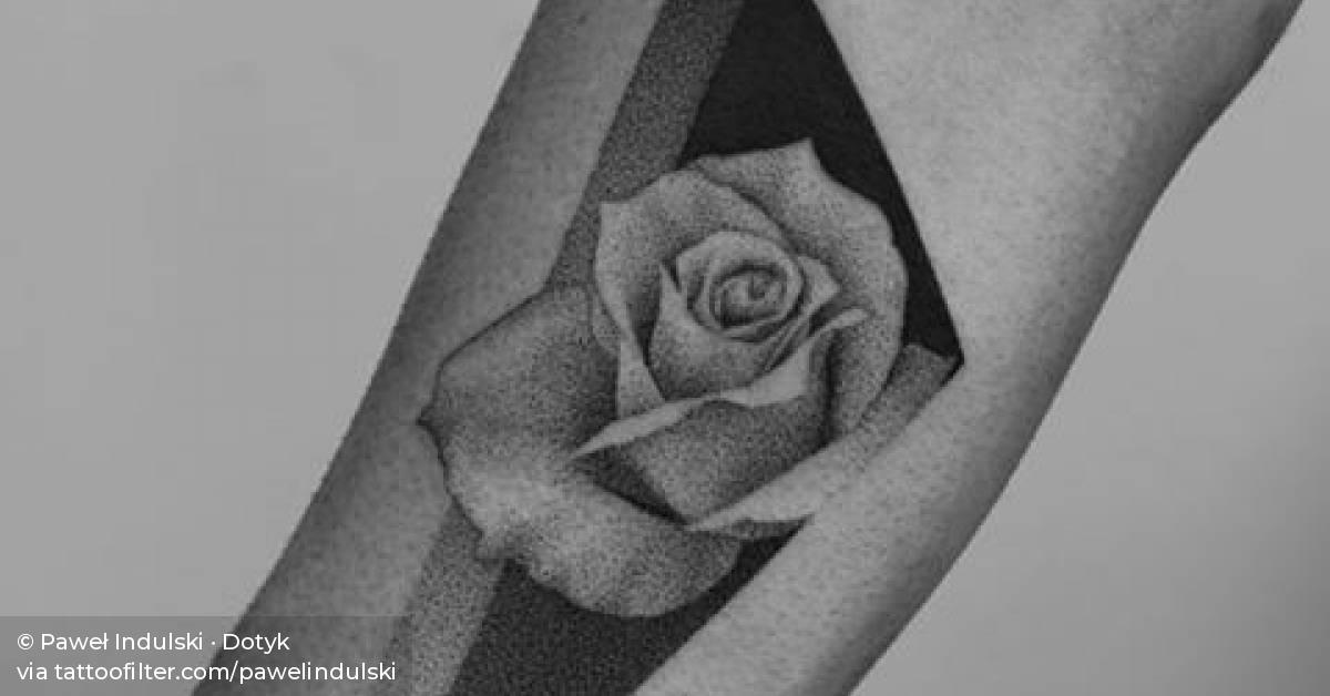 Dotwork rose on the inner forearm.