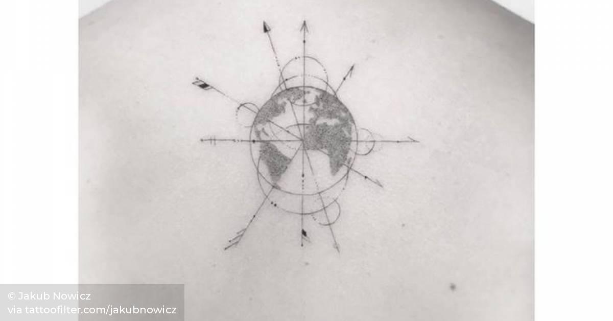 Fine line earth tattoo on the upper back.