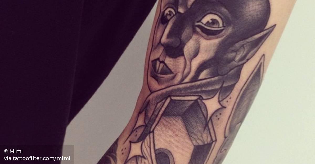 Nosferatu tattoo on the left arm.