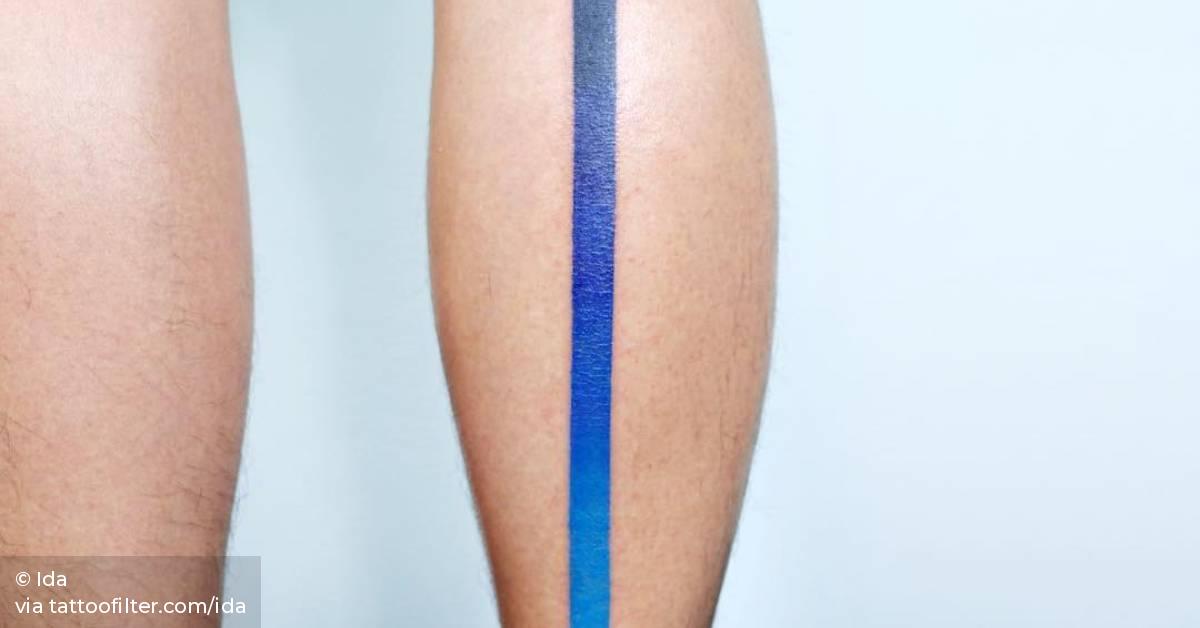 Spectrum line tattoo on the right calf.