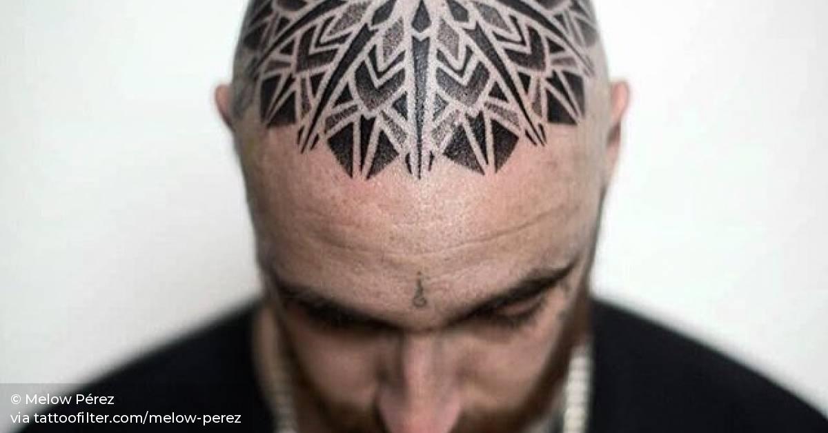 Mandala tattoo on the head.