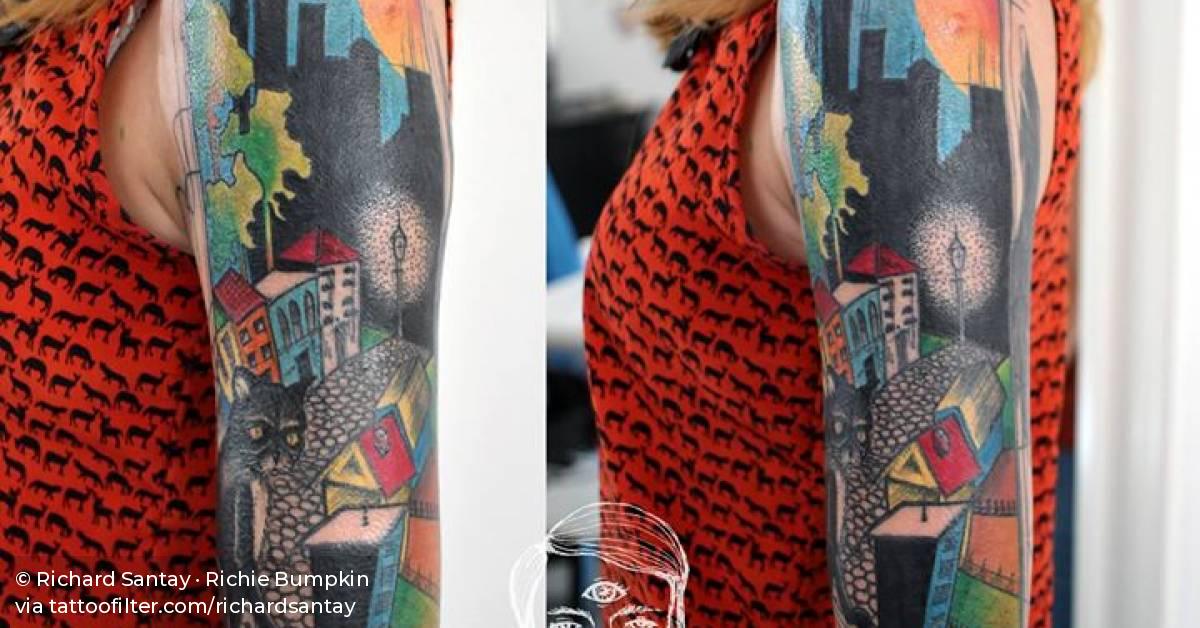 Illustrative tattoo on the left upper arm. Design by
