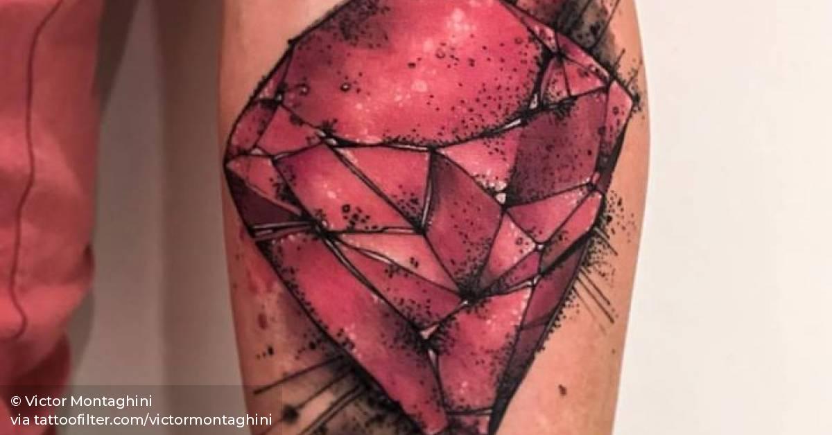 Sketchy ruby stone tattoo on the left inner forearm.