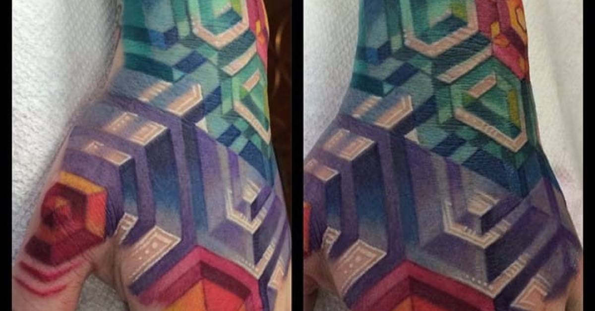 Abstract geometry tattoo on the left hand.