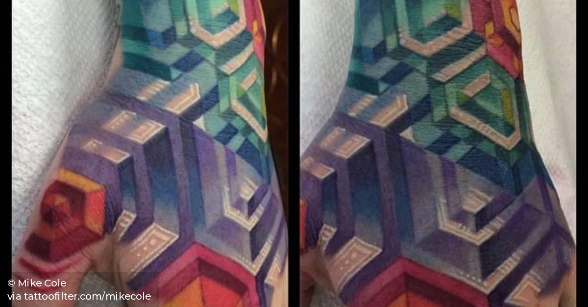 Abstract geometry tattoo on the left hand.