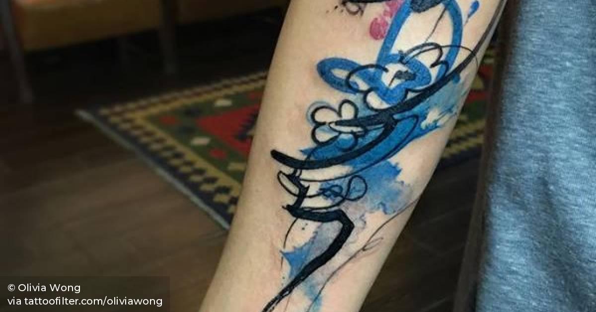 Abstract tattoo on the right arm.