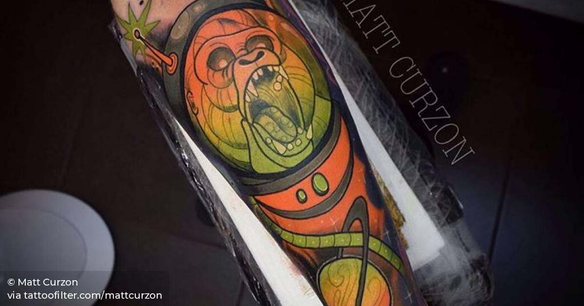 Monkey chimpanzee tattoo on the forearm.