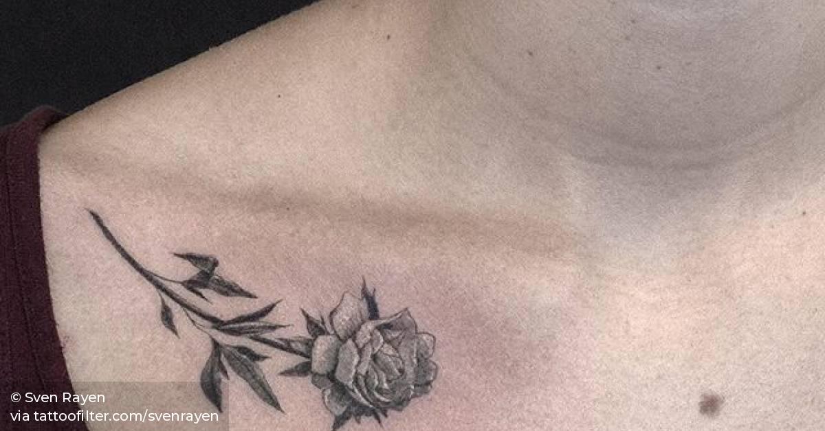 Fine line rose tattoo on the right collarbone.