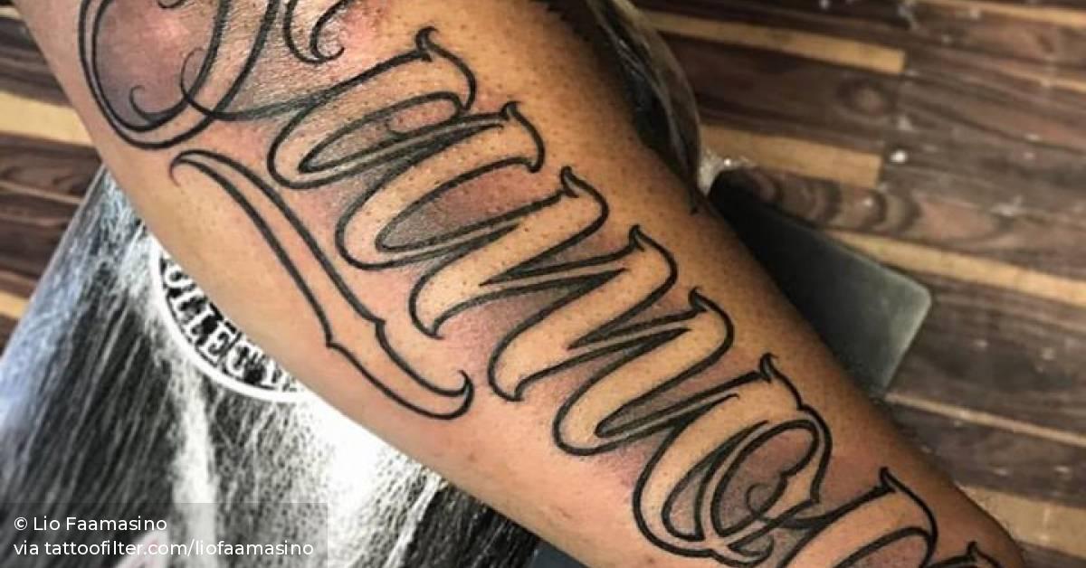 Lettering "Samoa" tattoo on the forearm.
