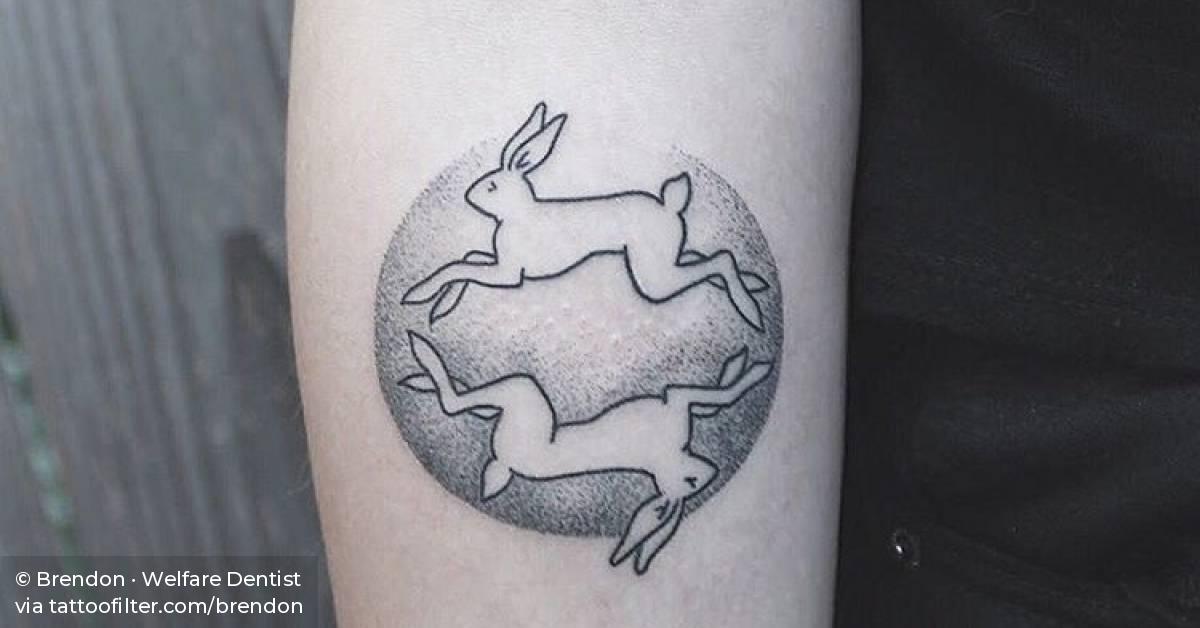 Hand poked rabbits on the inner forearm.