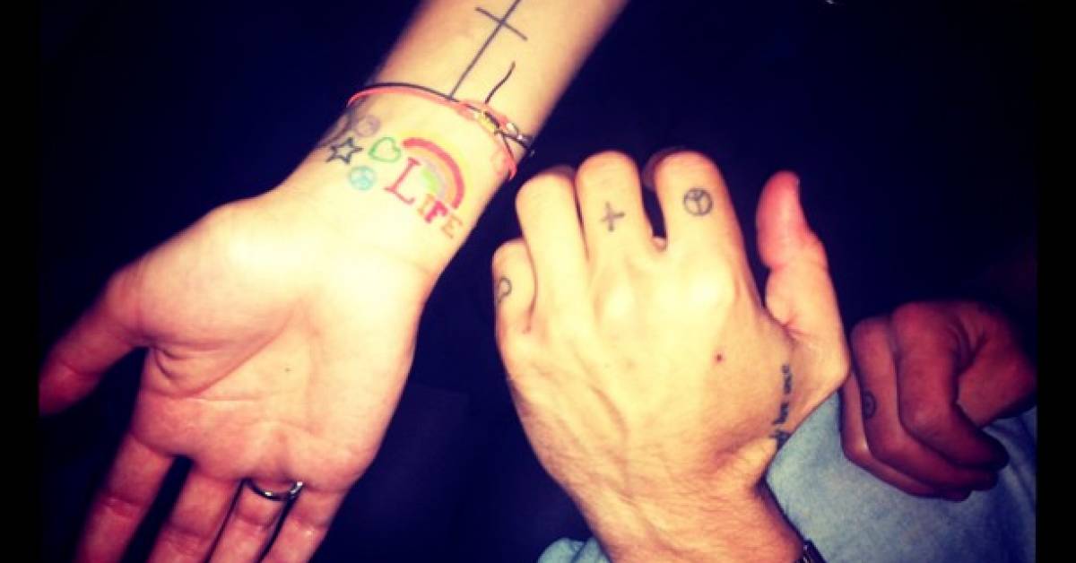 Ruby Rose's christian cross on the right inner forerm,