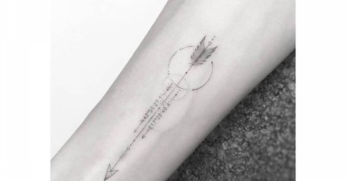 Fine line arrow tattoo.