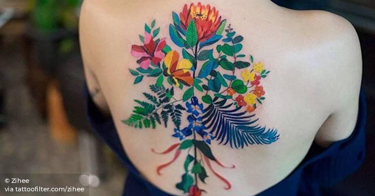 Illustrative flower bouquet tattoo on the back.