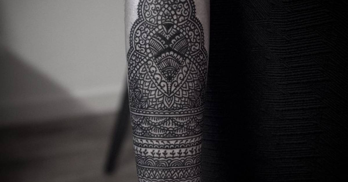 Ornamental style forearm tattoo.