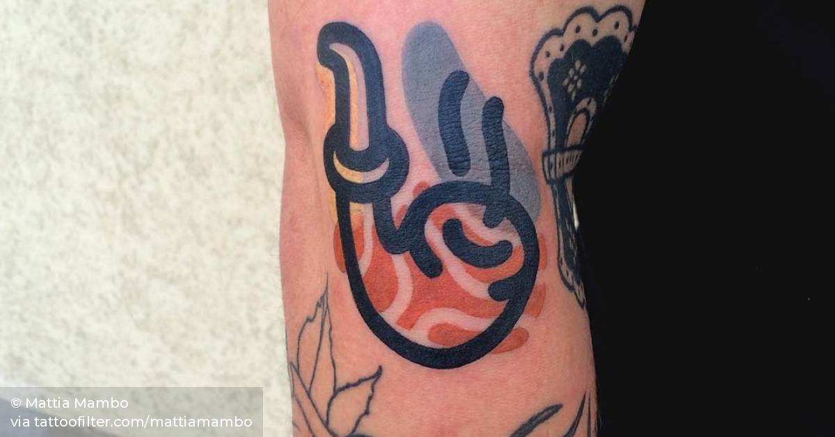 Smoking pipe tattoo on the right arm.