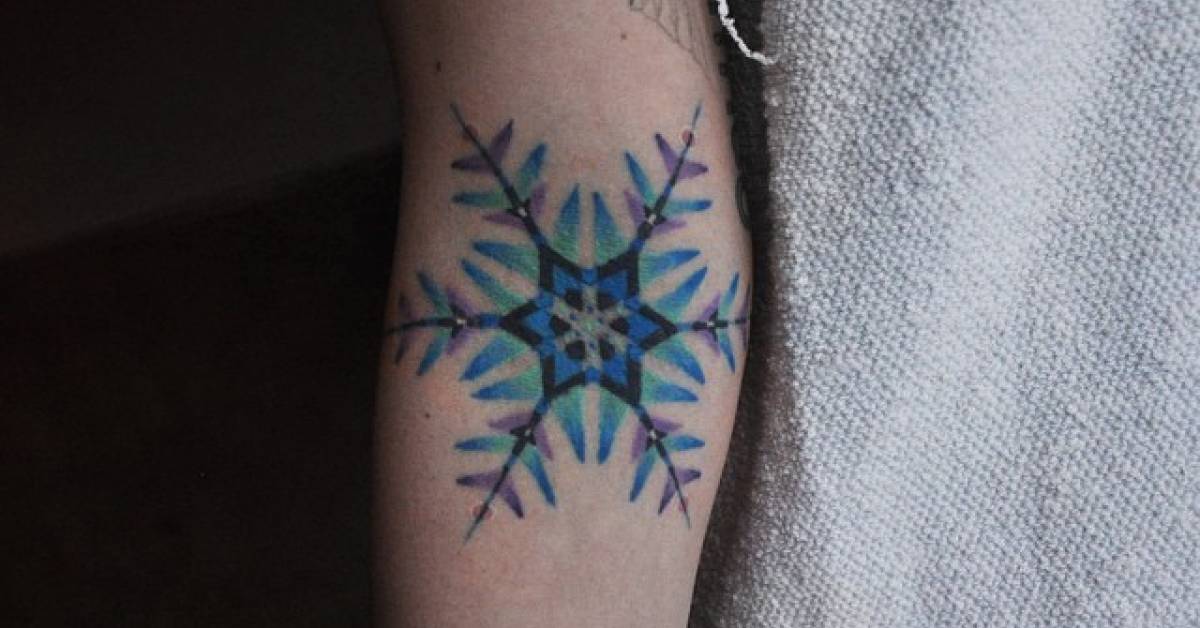 Snowflake tattoo on the right arm (healed, 1 year old).